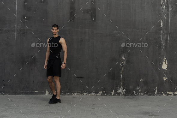 Sport model man posing gray wall background Stock Photo by arthurhidden