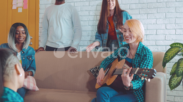 Group of Friends Play Guitar Together and Sing Songs, Stock Footage