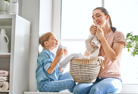 family doing laundry at home Stock Photo by choreograph | PhotoDune