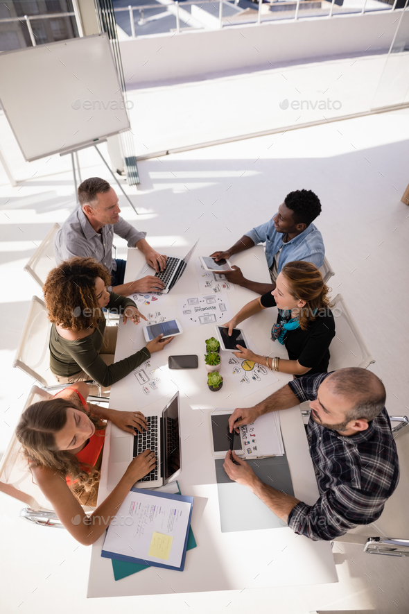 Executives interacting with each other during meeting Stock Photo by ...