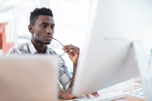 Executive working on computer in office Stock Photo by Wavebreakmedia