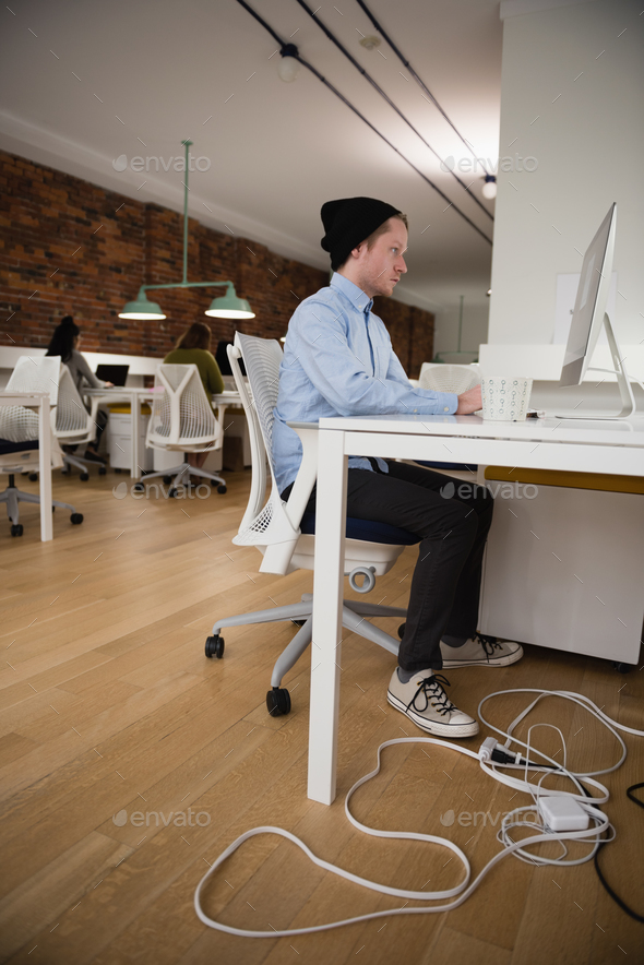 Executive working on computer in office Stock Photo by Wavebreakmedia