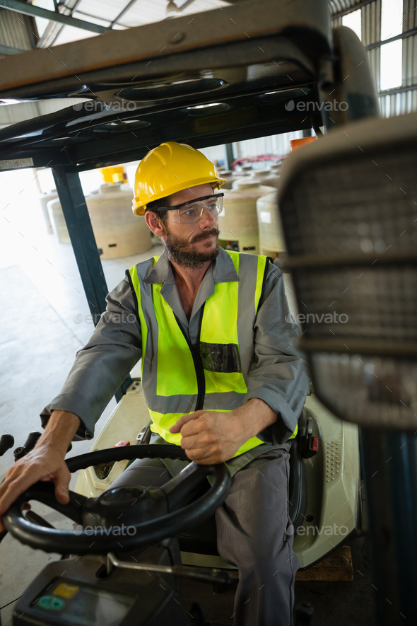 Worker driving a forklift car Stock Photo by Wavebreakmedia | PhotoDune