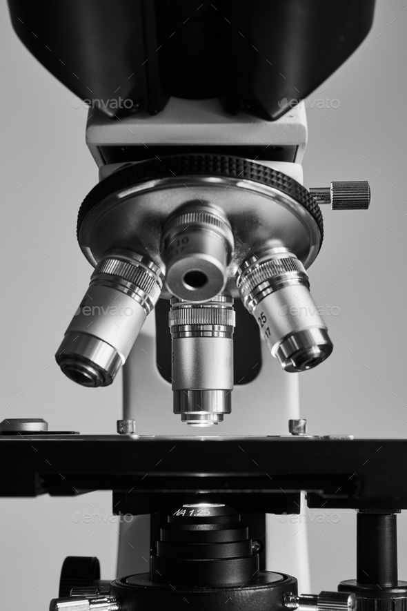 Modern microscope with metal lens at laboratory. Stock Photo by ...