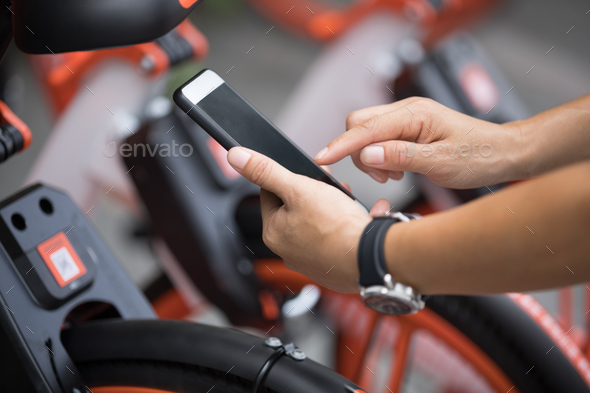 Scanning the bike sharing QR code Stock Photo by lzf | PhotoDune