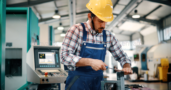 modern industrial machine operator working in factory Stock Photo by nd3000