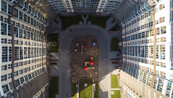 Bird-eye view of the playground kids in a residential complex in sunny ...