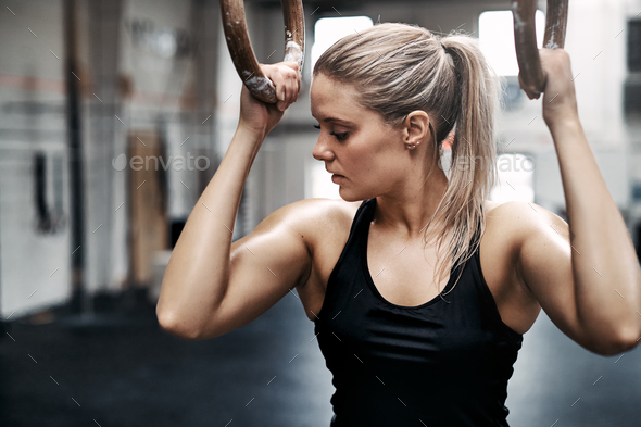 Fit young woman sweating during a gym workout with rings Stock Photo by ...