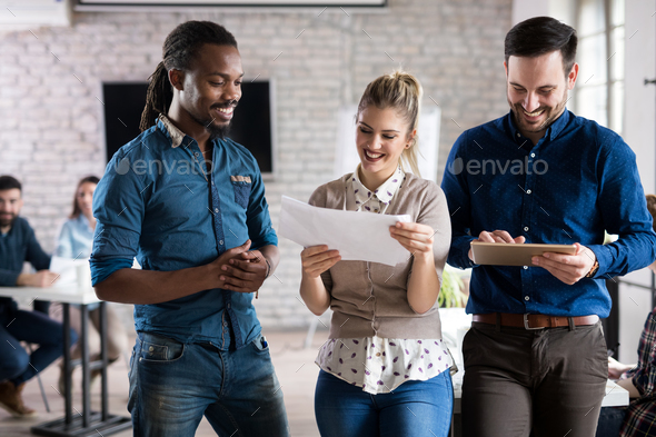 Portrait of architects having discussion in office Stock Photo by nd3000