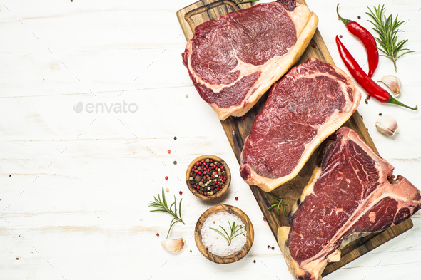 Raw meat beef steak on white top view Stock Photo by Nadianb | PhotoDune