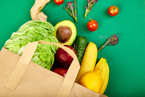 Grocering concept. Full paper bag of different fruits Stock Photo by ...
