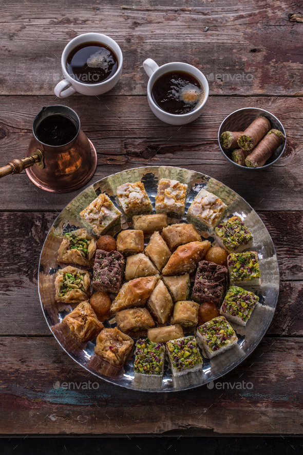 Arabian sweets and delights with coffee on rustic table Stock Photo by ...