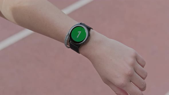Runner Starting Smart Watch Timer and Running. Smart Watch on Female ...