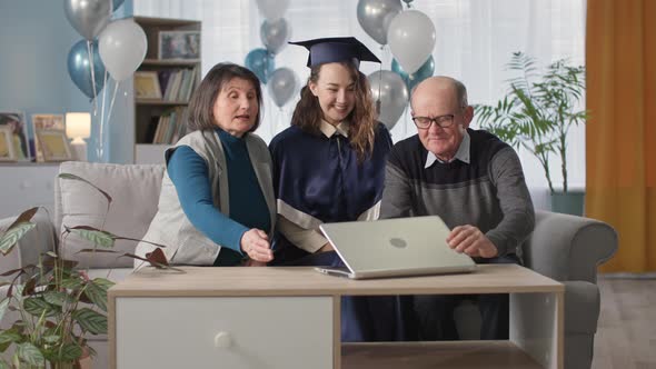 Family with Graduate Celebrating End of School Year Online and ...