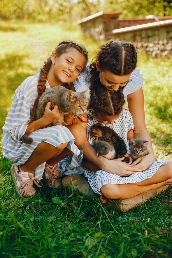 three beautiful girls with cats Stock Photo by prostooleh | PhotoDune
