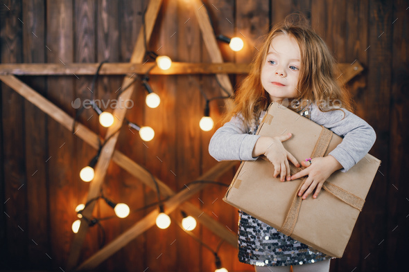 litle girl opening presents Stock Photo by prostooleh | PhotoDune