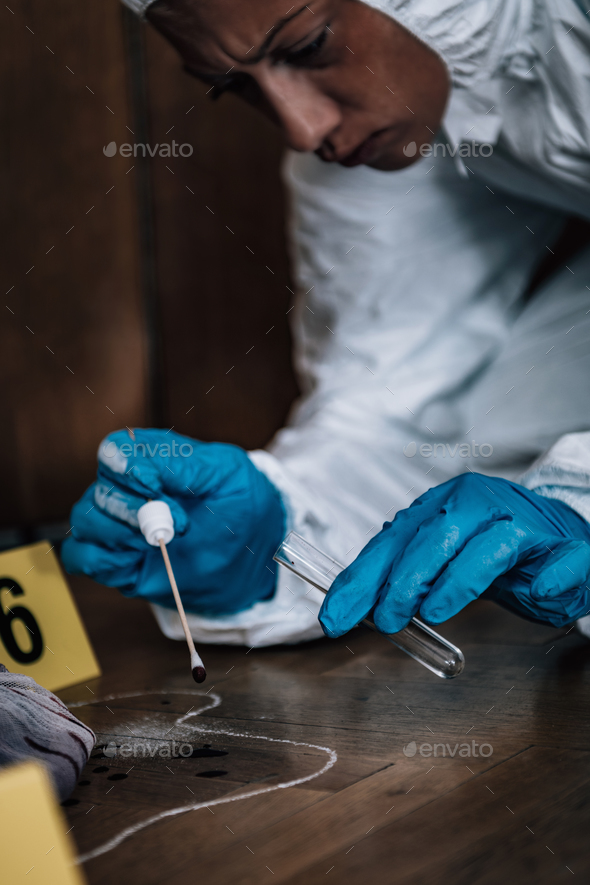 Forensics. Collecting Clues from the Crime Scene Stock Photo by microgen