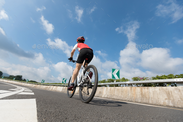 Cycling on the road Stock Photo by lzf | PhotoDune