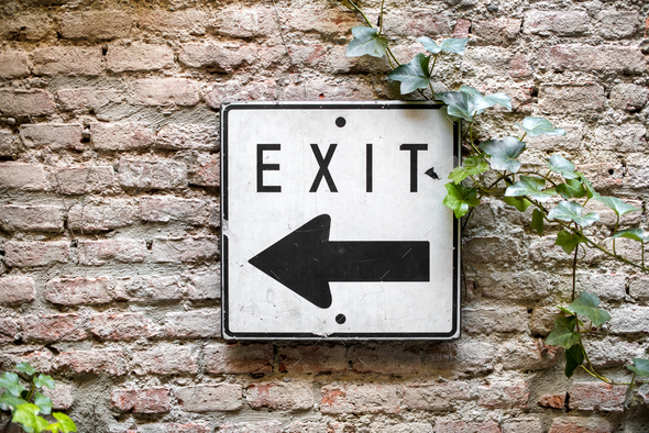 Exit direction sign pointing to the left Stock Photo by Photology75
