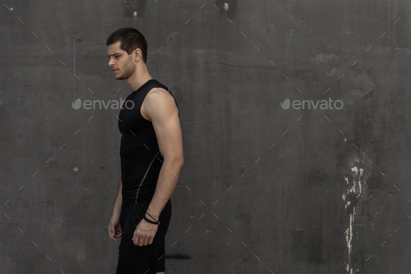 Sport model man posing gray wall background Stock Photo by arthurhidden