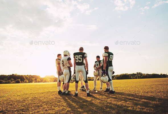 American football standing together on a field during practice Stock ...