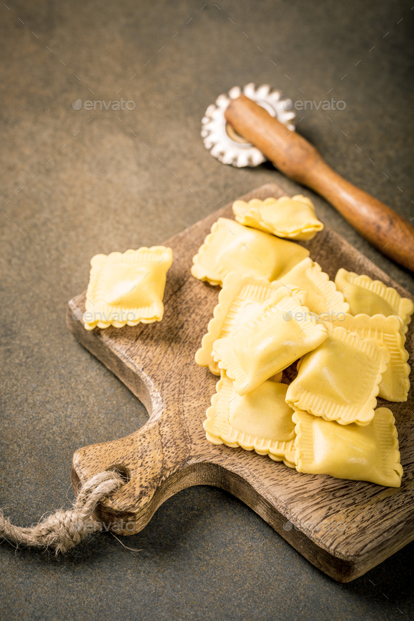 Fresh homemade filled square pasta ravioli Stock Photo by Merinka ...