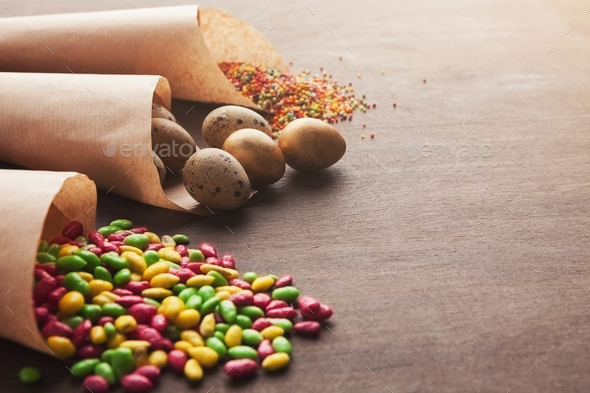 Golden easter eggs and colorful candies craft cornets Stock Photo by ...