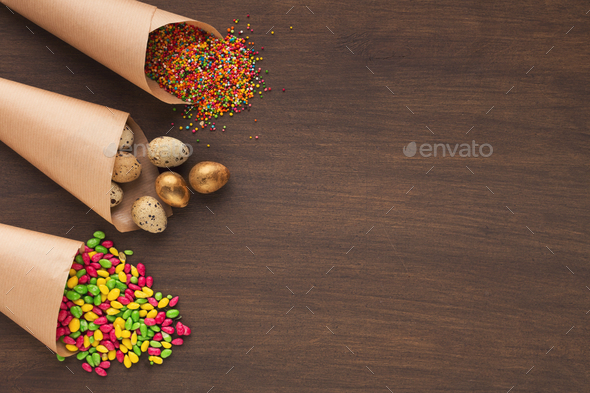 Golden easter eggs and colorful candies craft cornets Stock Photo by ...