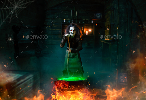 Scary witch cooking potions and reads the spell Stock Photo by NomadSoul1