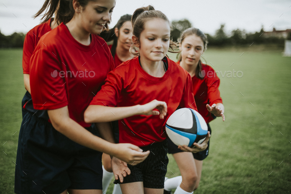 Female rugby players in action on the field Stock Photo by Rawpixel