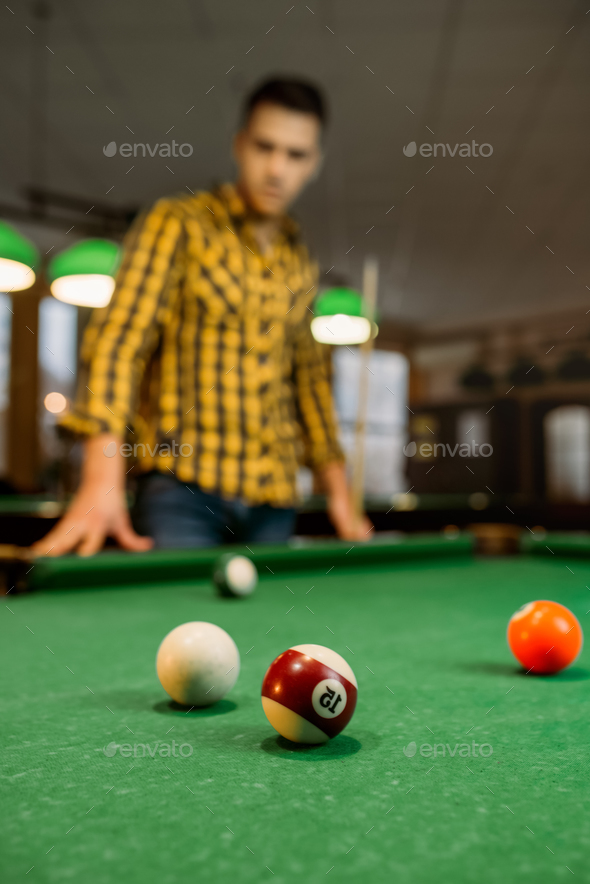 Male billiard player with cue, view from the table Stock Photo by ...