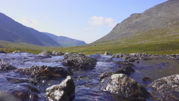A Stormy Stream of River Carving Its Way Through the Mountain Valley ...