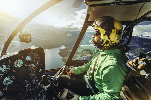 Helicopter pilot. Stock Photo by voimages | PhotoDune