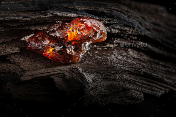 Natural amber. A piece of yellow and red semi transparent natural amber ...