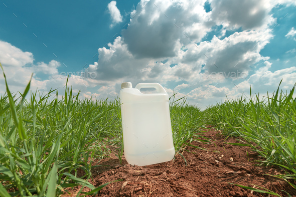 Blank pesticide jug container mock up in wheatgrass field Stock Photo ...