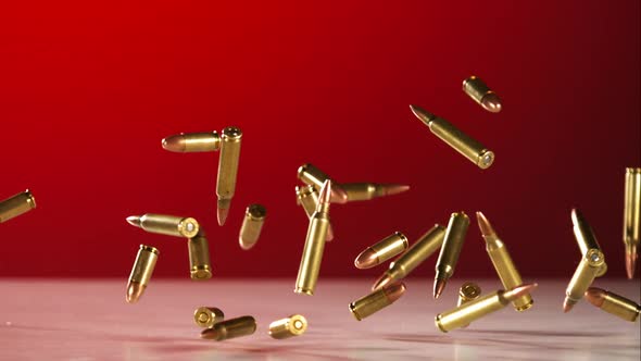 Bullets falling bouncing in ultra slow motion 1500fps on a reflective ...