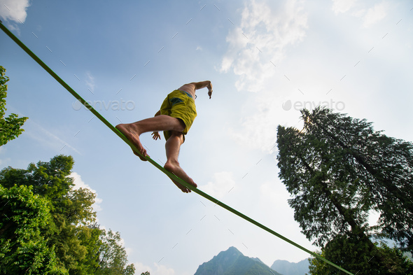 Boy practices walking on the rope Stock Photo by michelangeloop | PhotoDune