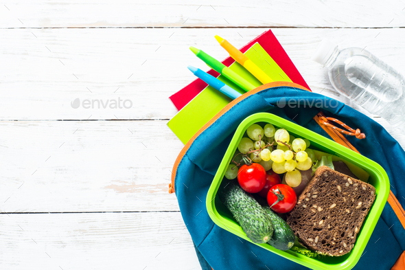 Back to school concept. Lunch box with stationery and backpack Stock ...