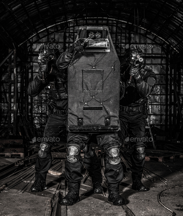 SWAT team members covering with ballistic shield Stock Photo by ...