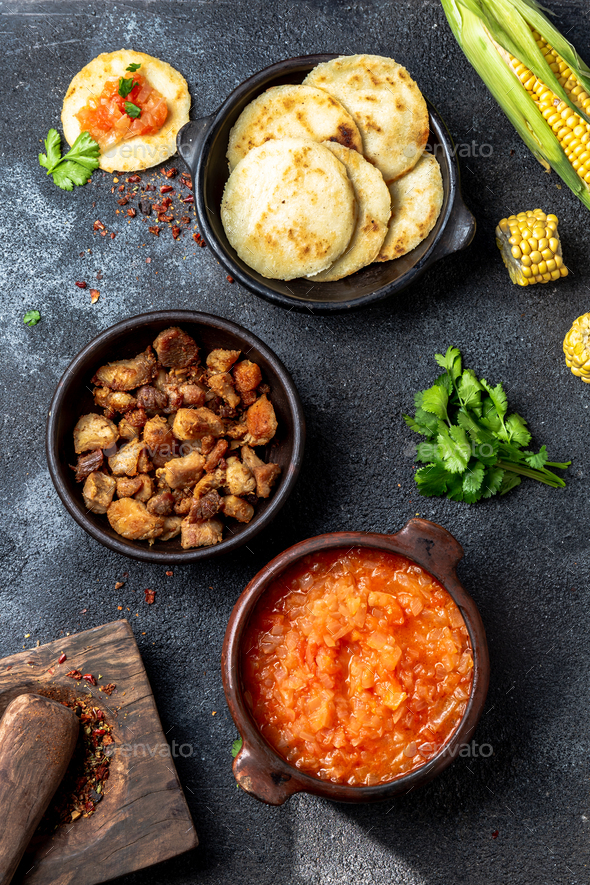 Colombian Food. Pork Chicharon, Maize Arepas, Tomato sauce Stock Photo ...