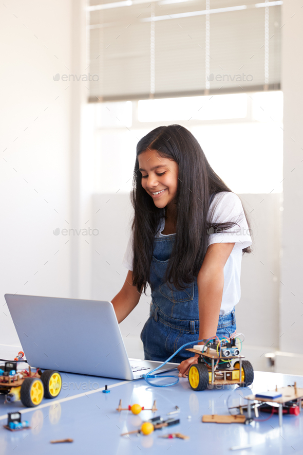 Female Student Building And Programing Robot Vehicle In After School Computer Coding Class Stock ...