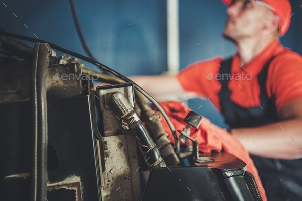 Construction Equipment Mechanic Stock Photo by duallogic | PhotoDune