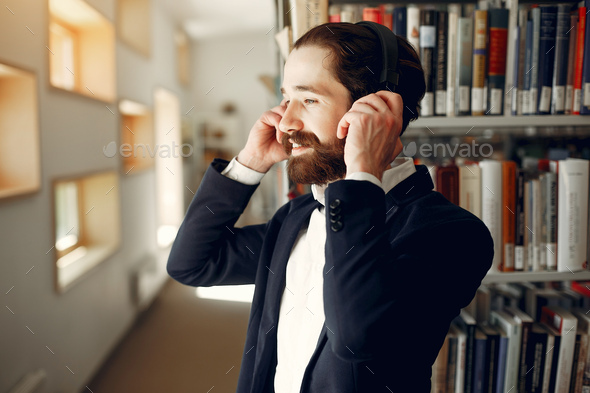 Handsome guy study at the library Stock Photo by prostooleh | PhotoDune