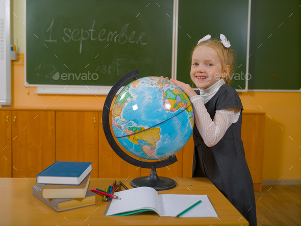 Little girl in school class at the lesson Stock Photo by oleghz | PhotoDune