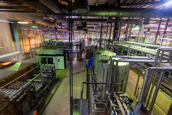 Industrial interior of soft drinks factory with tubes Stock Photo by ...
