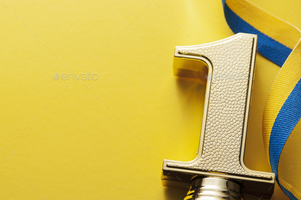 Number one gold winners trophy for a competition Stock Photo by sergign