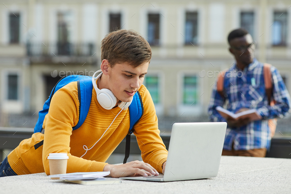 College Student Working Outdoors Stock Photo by seventyfourimages ...