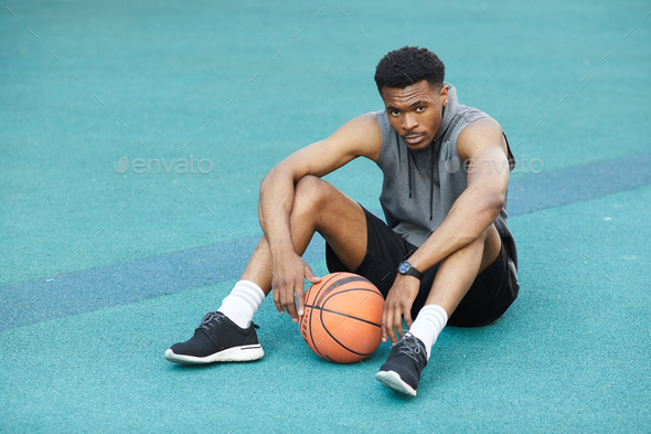 Basketbal Player Resting Stock Photo by seventyfourimages | PhotoDune