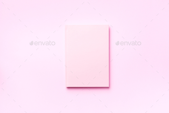 Top view of open pink notebook on pastel colorful background. Copy ...