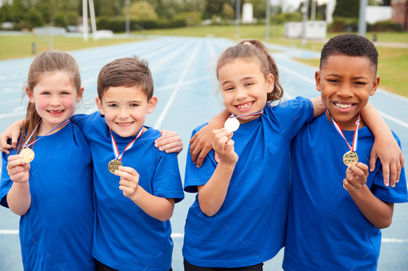 Portrait Of Children Showing Off Winners Medals On Sports Day Stock ...